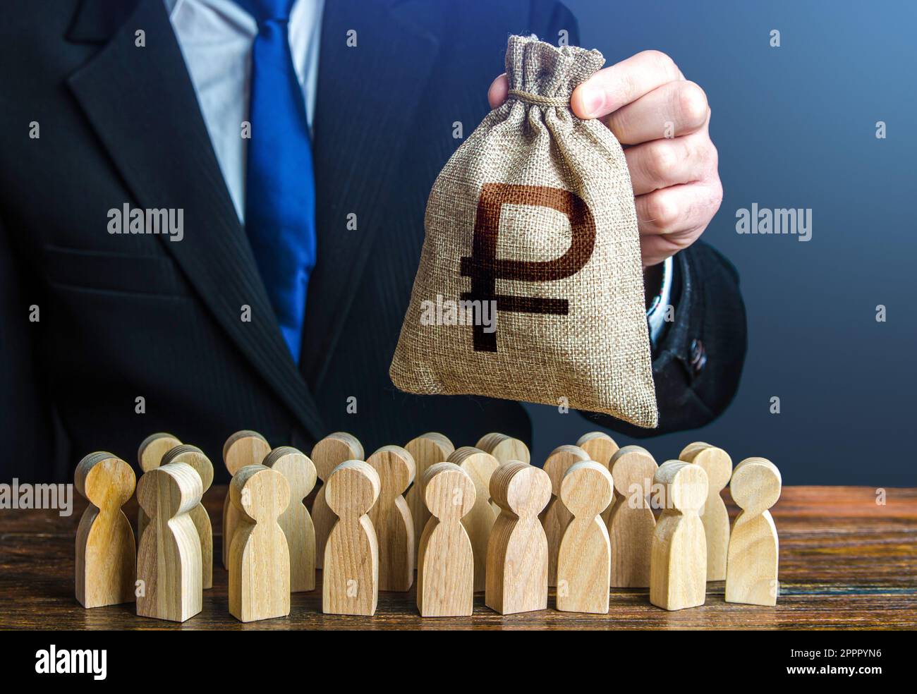 A businessman is holding a russian ruble money bag over a crowd of ...