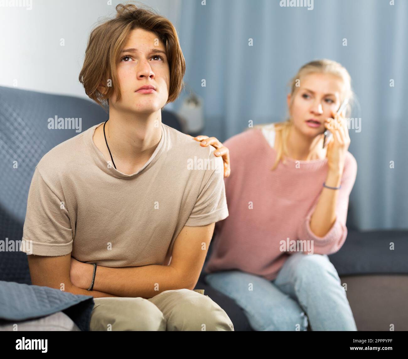 Worried mom calling doctor hi-res stock photography and images - Alamy