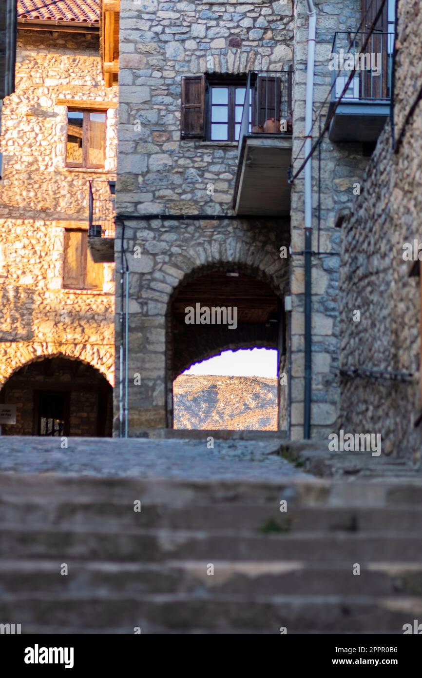 Beautiful old stone cobble rock building with an arch made of stone ...