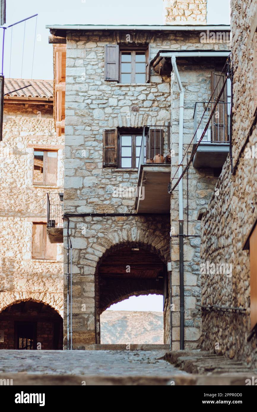 Beautiful old stone cobble rock building with an arch made of stone ...