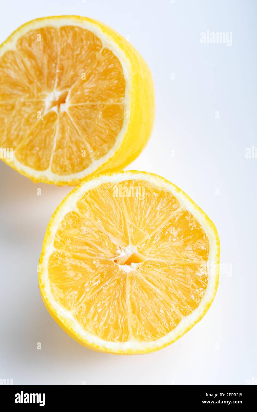 Lemon fruit cut in half, isolated on white background. Lemon cut in ...