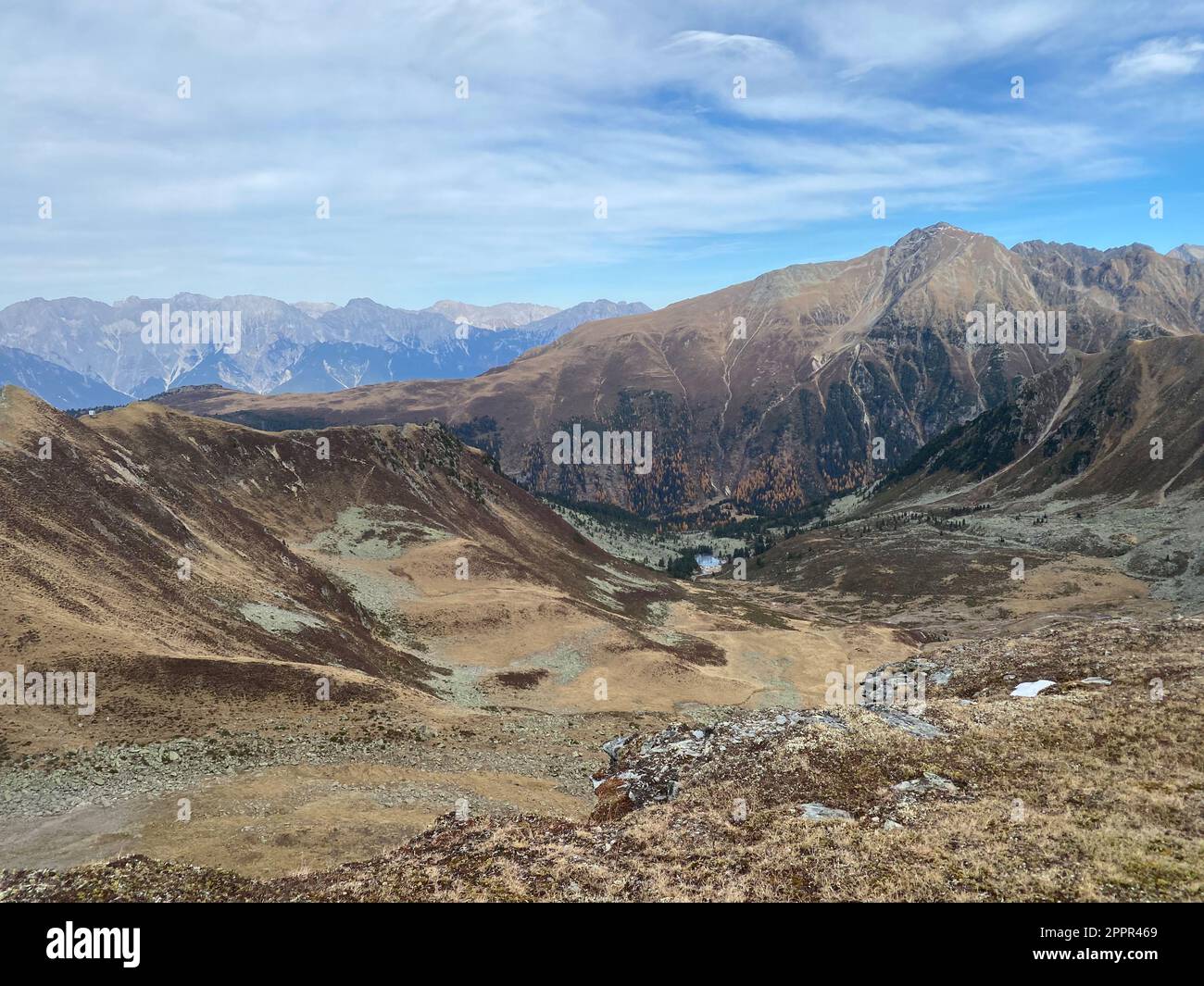 An aerial view of the dry arid fields and rocky Austrian Alps Stock ...