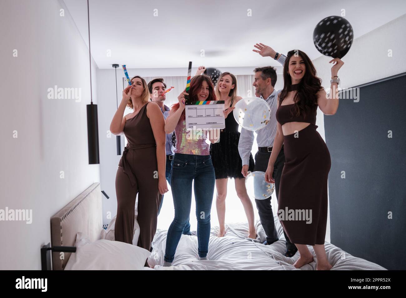 Group of friends having a very crazy party on the floor and having a ...