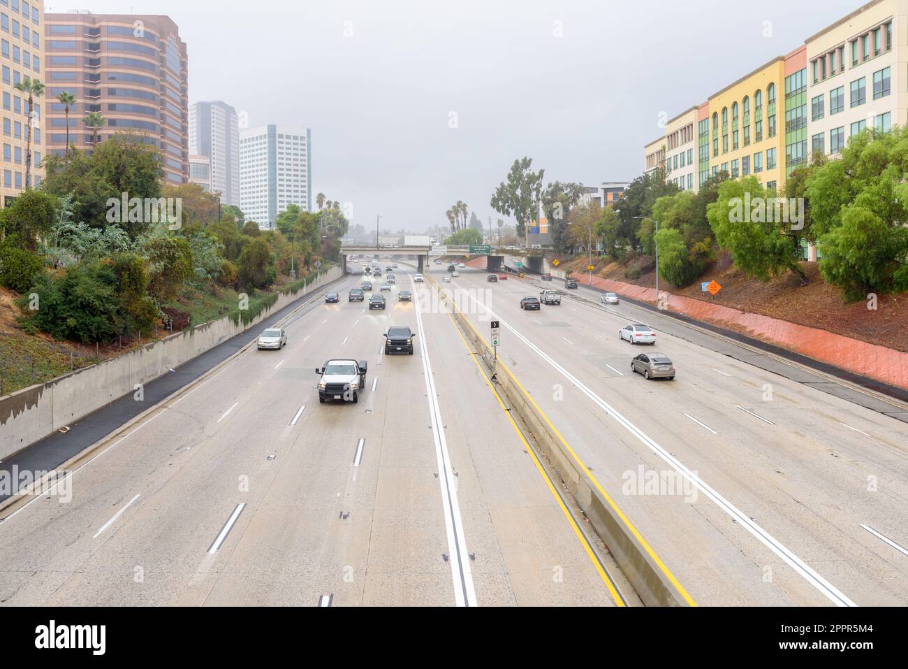 Traffic on a multi-lane freeway on a rainy autumn day Stock Photo - Alamy