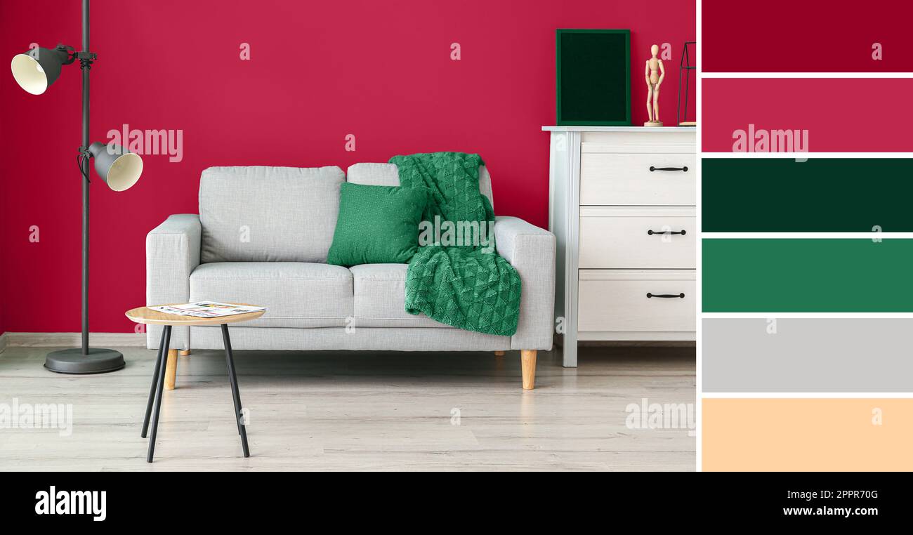 Interior of living room with grey sofa near viva magenta wall ...