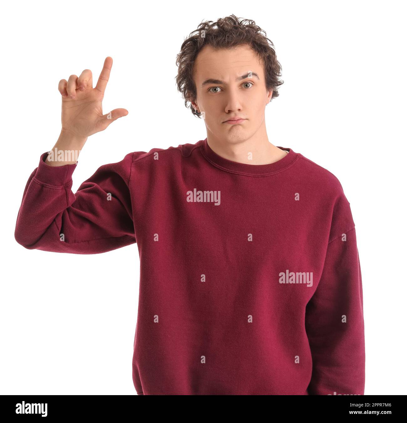 Young man showing loser gesture on white background Stock Photo - Alamy