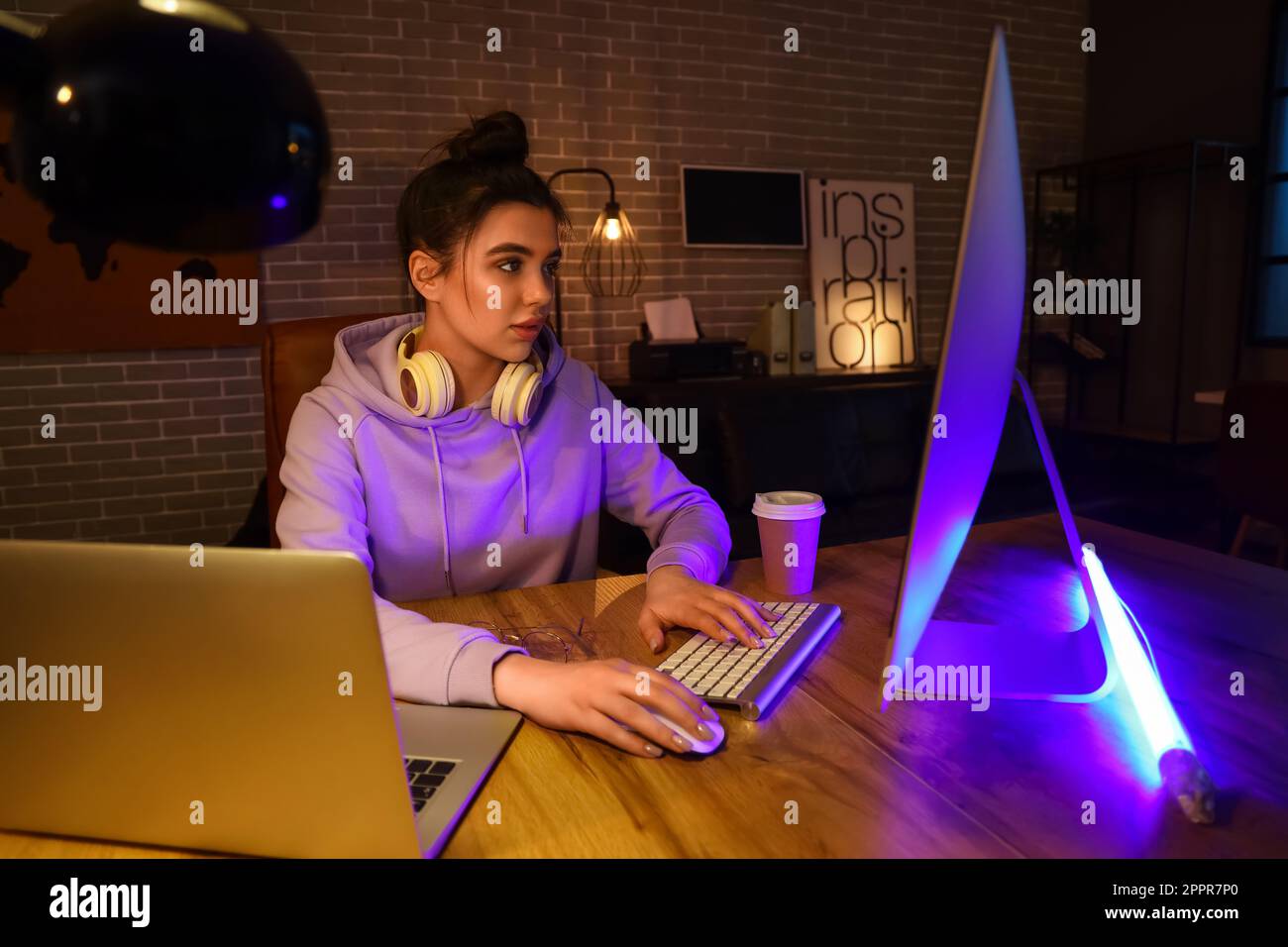Young female programmer working in office Stock Photo - Alamy