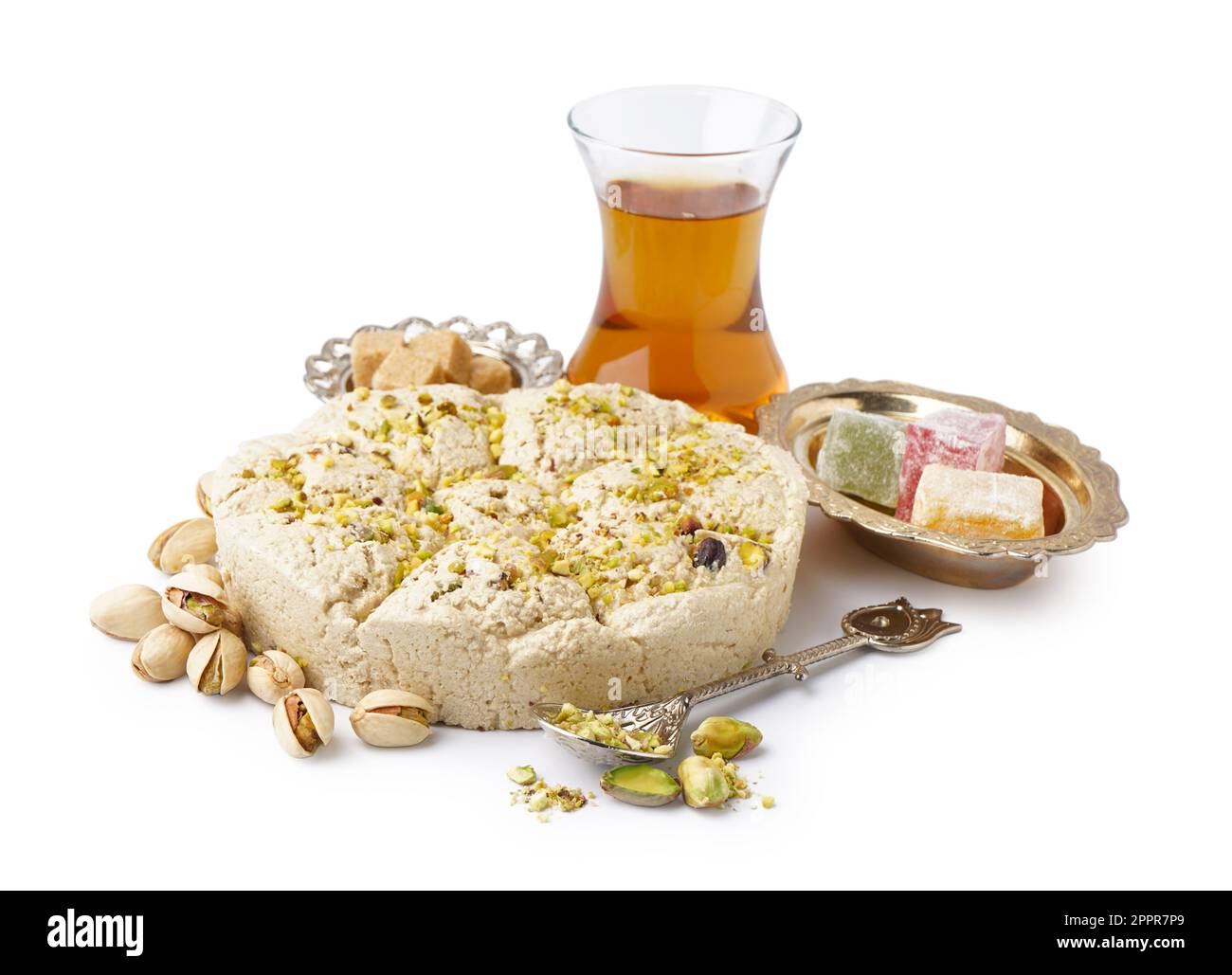 Tasty Tahini halva with pistachios, Turkish delight and glass of tea on ...