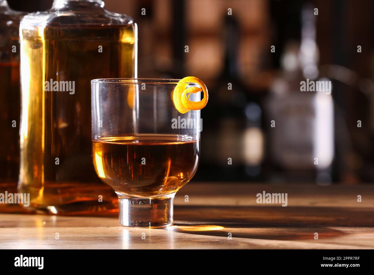 Glass of cold rum on table in bar Stock Photo - Alamy
