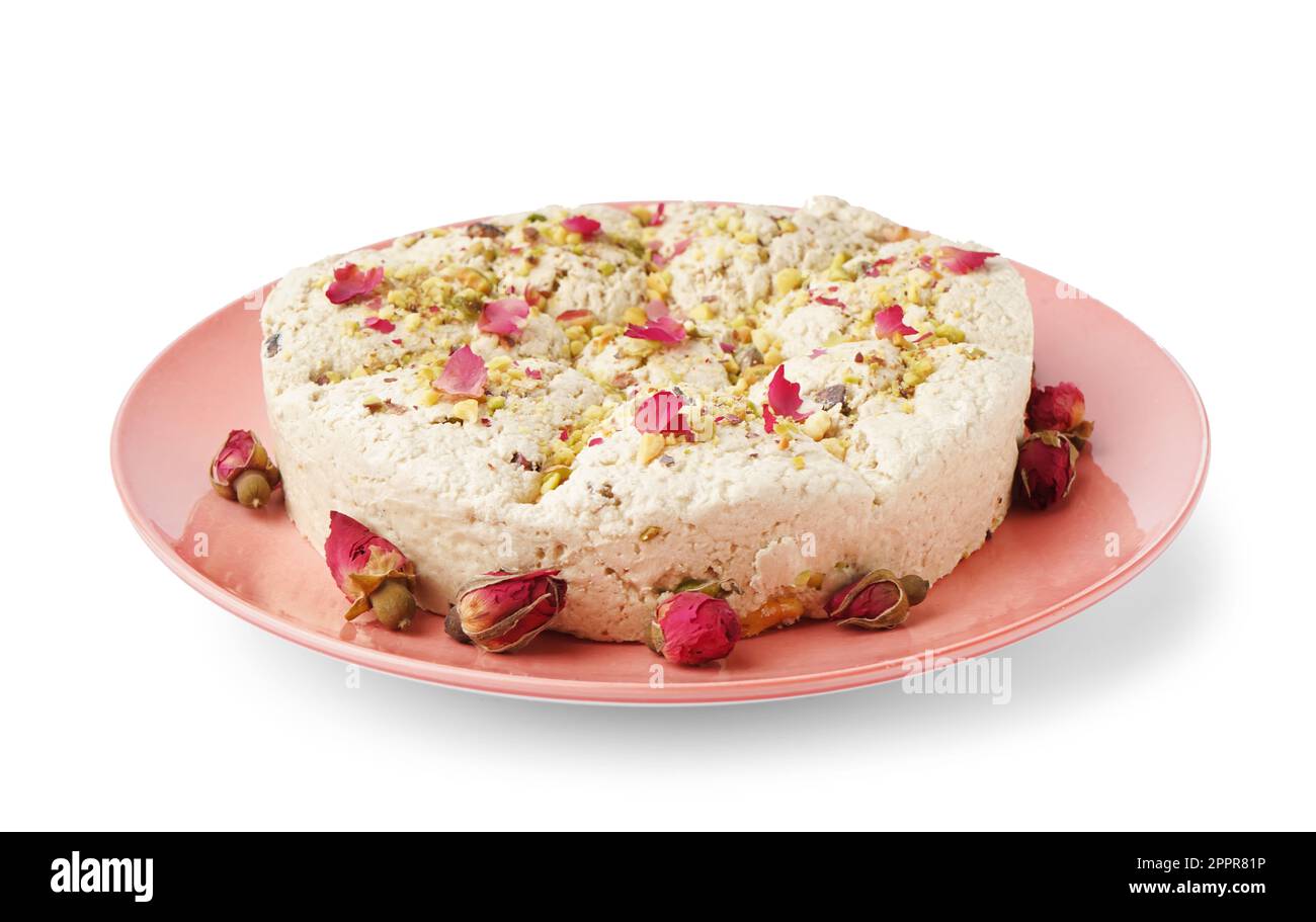 Plate of tasty Tahini halva with pistachios on white background Stock Photo - Alamy