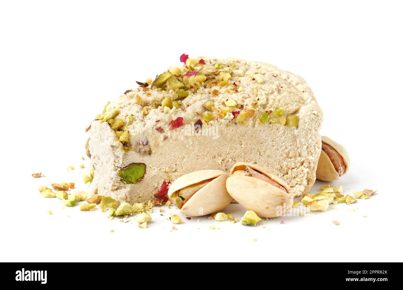 Piece of tasty Tahini halva with pistachios on white background Stock Photo - Alamy