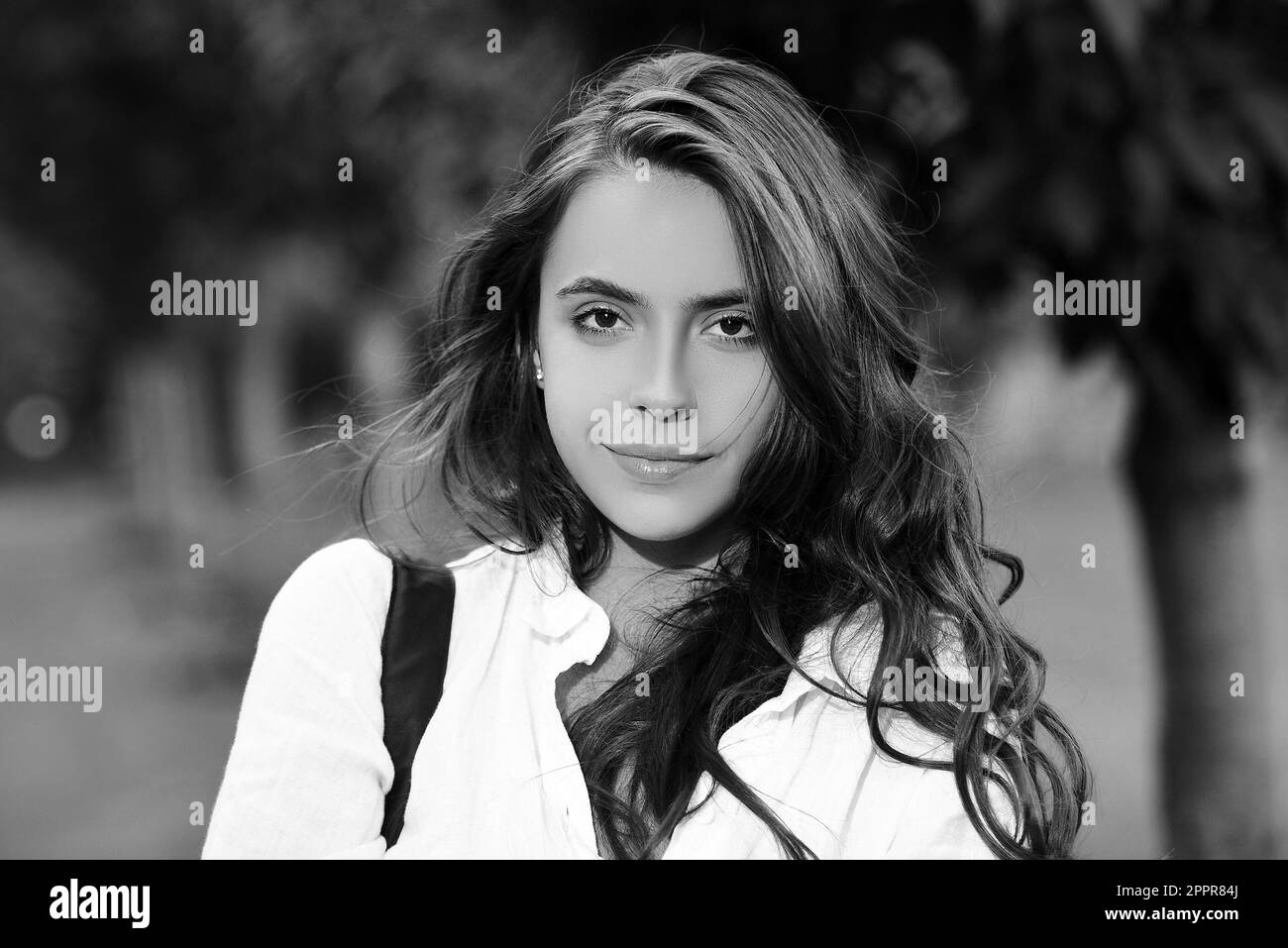 University female student outdoor. Smiling girl portrait Stock Photo - Alamy