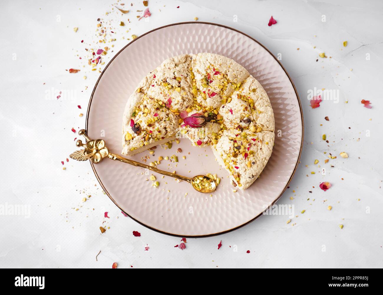 Plate of tasty Tahini halva with pistachios on white background Stock ...