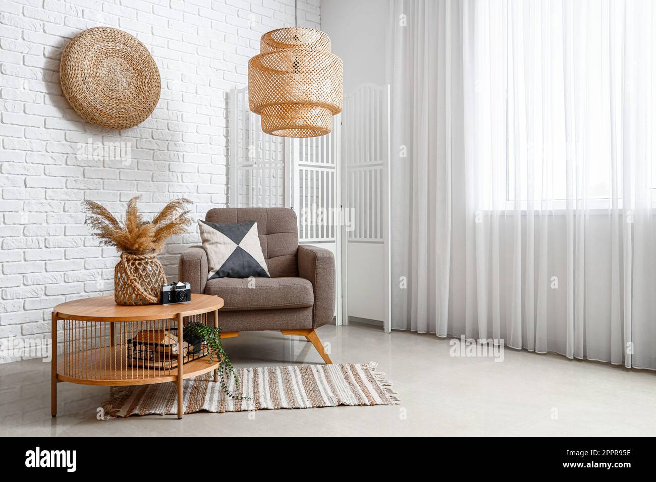 Interior of cozy living room with armchair and coffee table Stock Photo ...