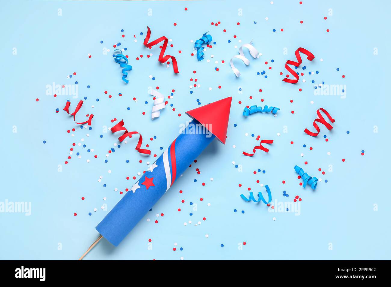 Firework rocket, confetti and serpentine for Independence Day on blue ...