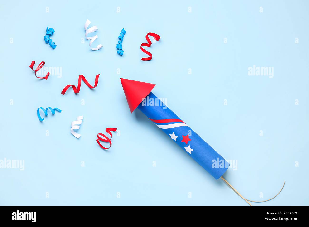 Firework rocket and serpentine for Independence Day on blue background ...