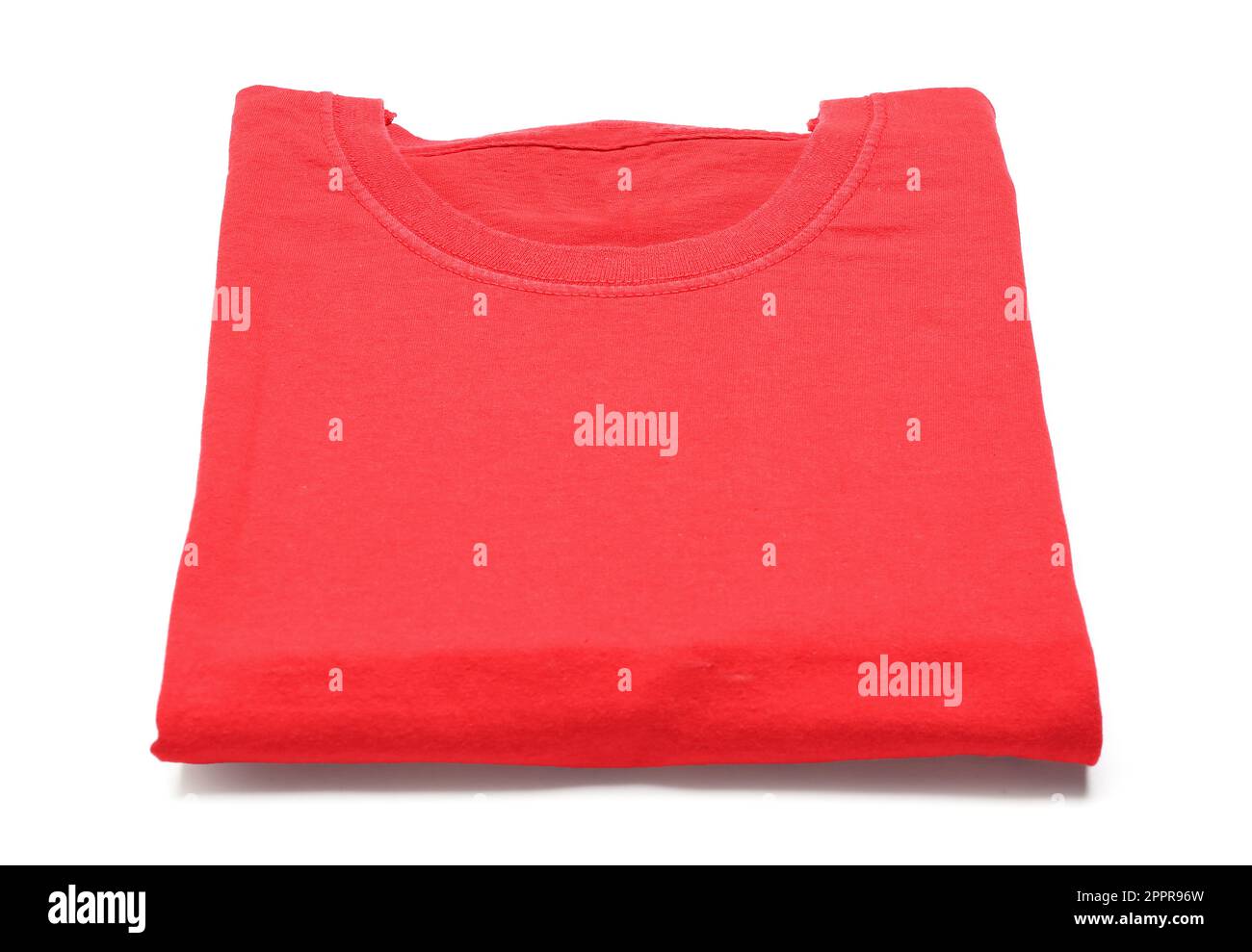 Folded red t-shirt on white background Stock Photo - Alamy