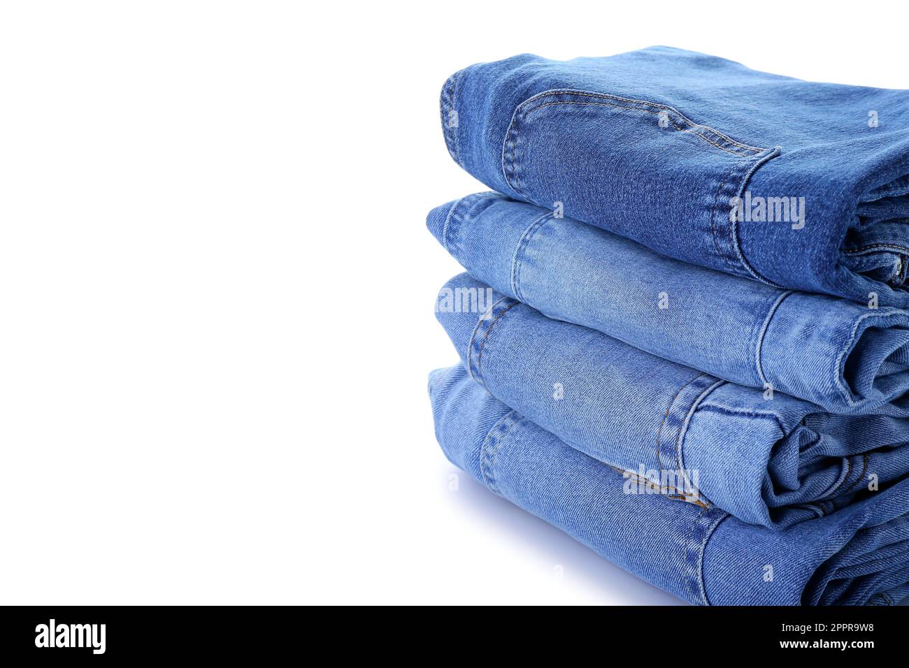 Stack of jeans on white background, closeup Stock Photo - Alamy