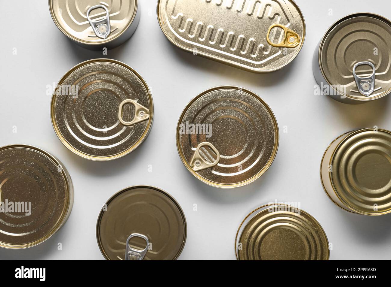 Assortment of tin cans with fish on white background Stock Photo - Alamy
