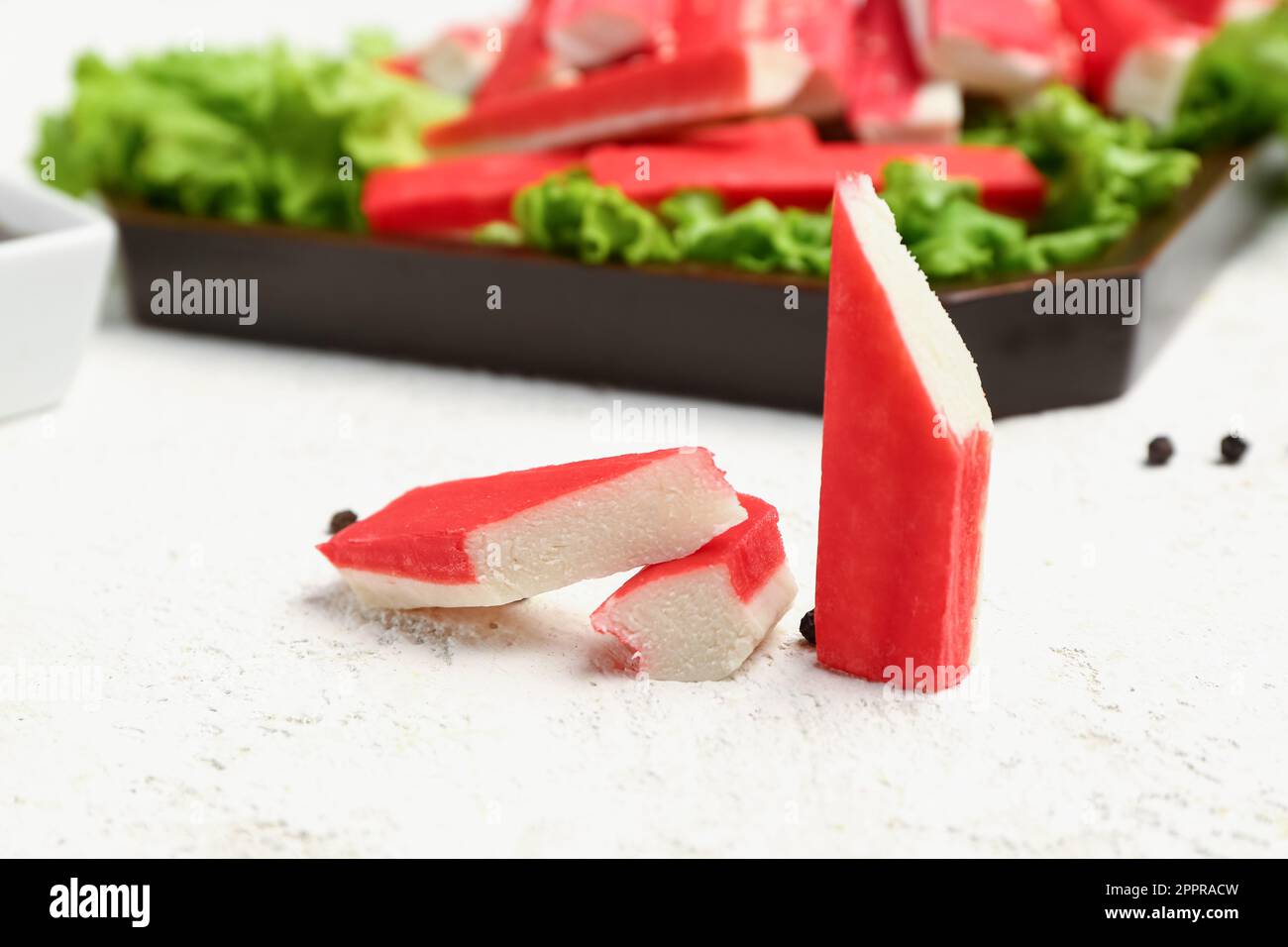 Tasty cut crab sticks on light background Stock Photo - Alamy