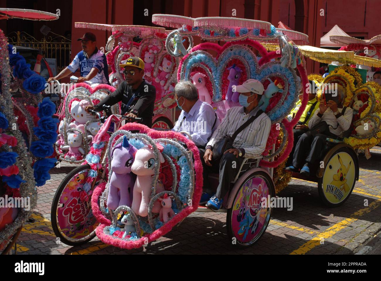 Decorated trishaw in front of St. Francis Xavier Church in Melacca ...
