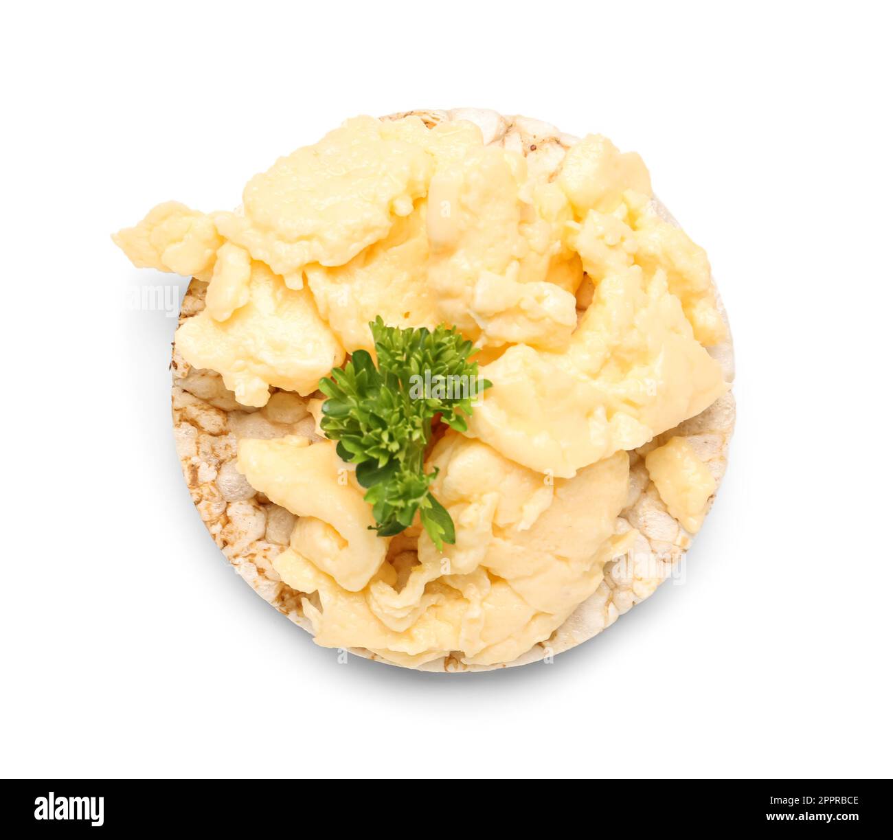 Puffed rice cracker with scrambled eggs on white background Stock Photo ...