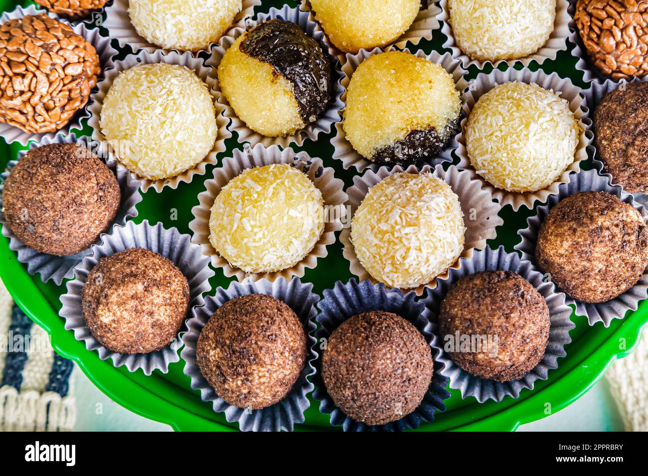 Brigadeiro (Brigadier) and coconut candy Traditional brazilian sweet ...