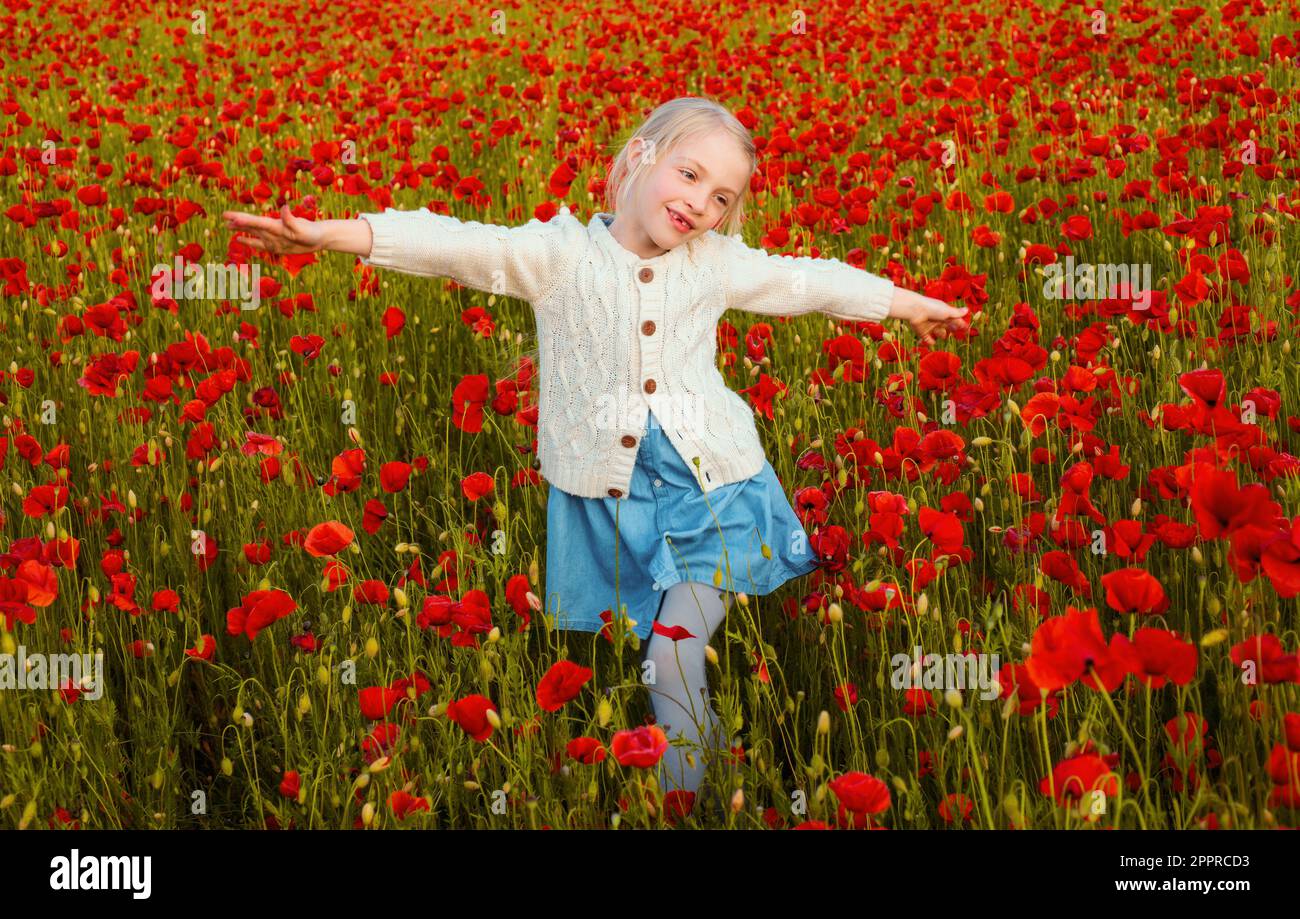 Girl in poppies, happiness and freedom, beautiful spring nature. Happy ...