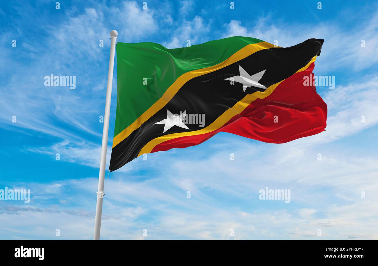 flag of English Creole peoples Kittians at cloudy sky background ...