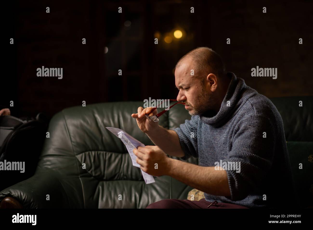 The man is shocked by the received letter. Surprise, negative emotions ...