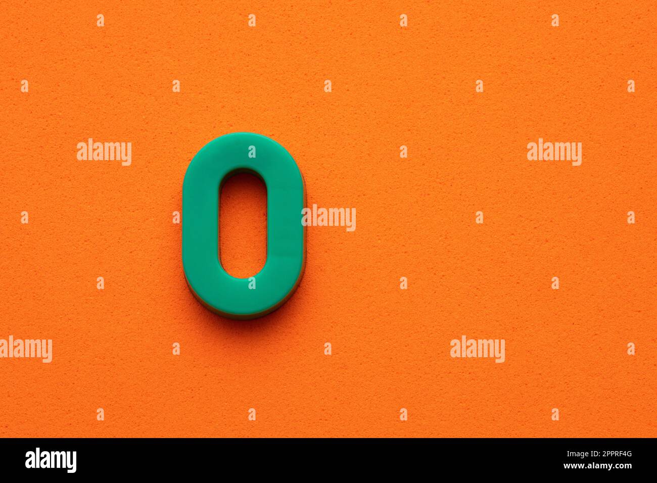 Letter O green plastic uppercase on orange foamy background Stock Photo ...