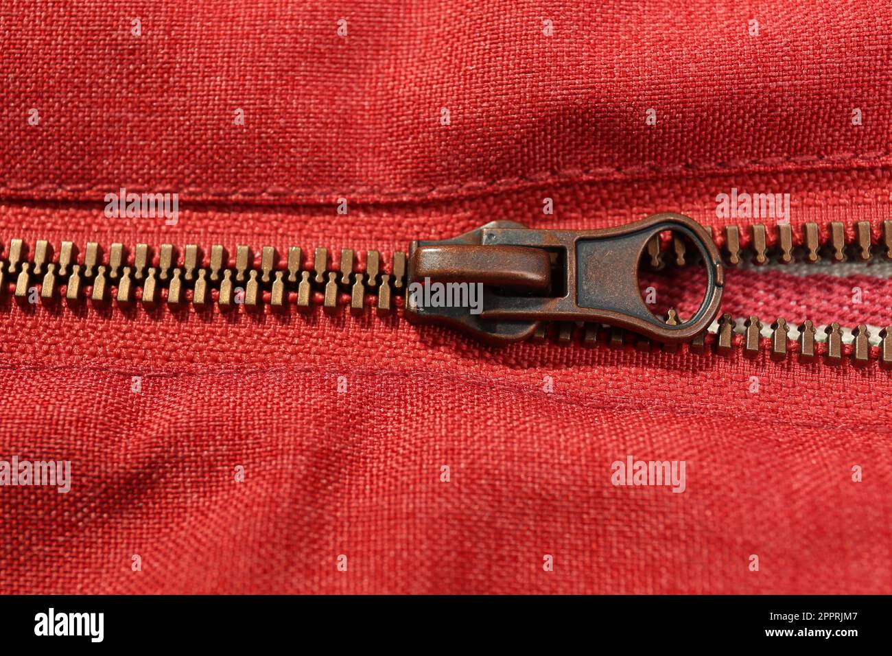 Red fabric with zipper as background, closeup view Stock Photo - Alamy