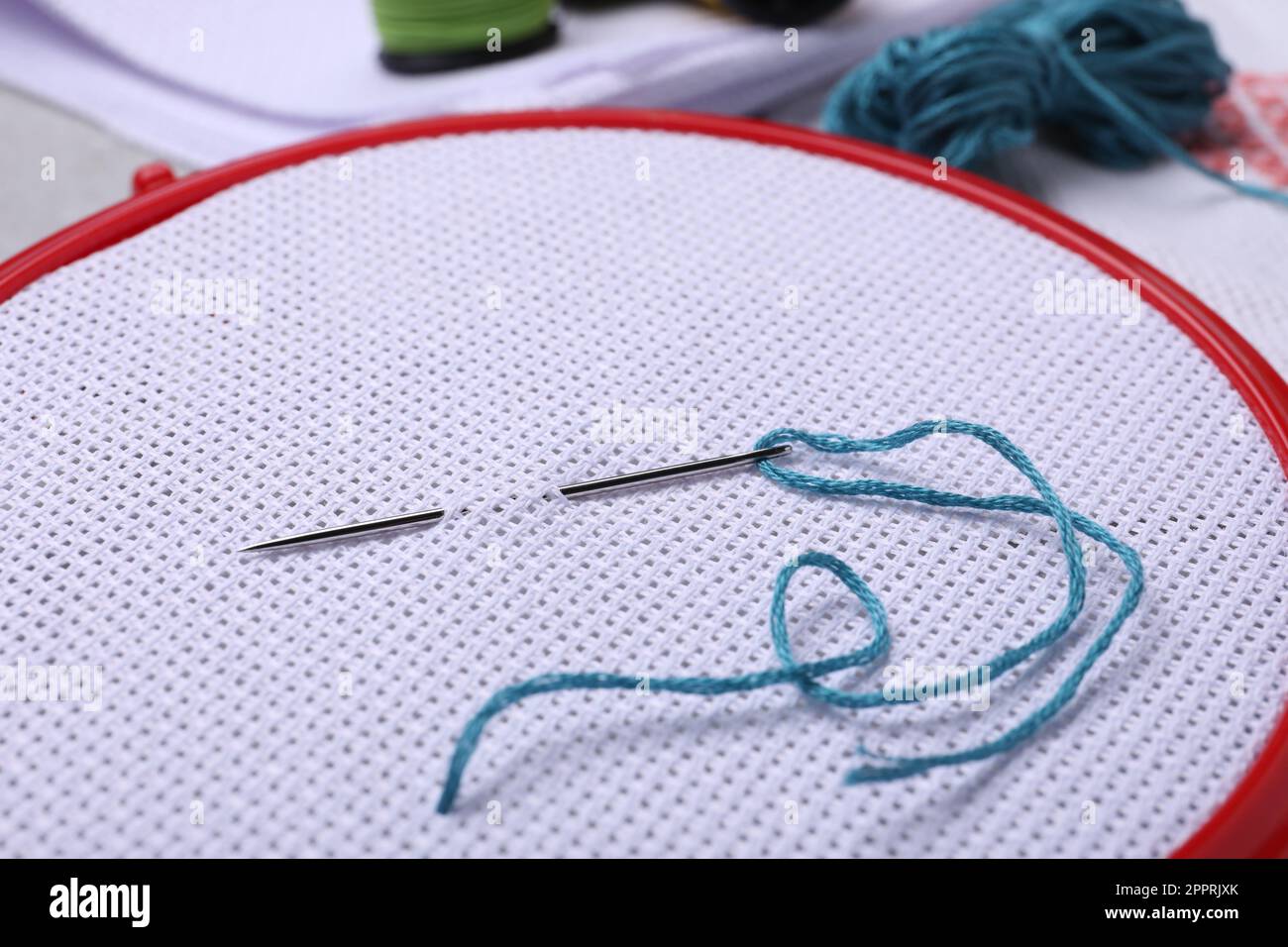 Embroidery hoop with fabric and needle, closeup Stock Photo - Alamy