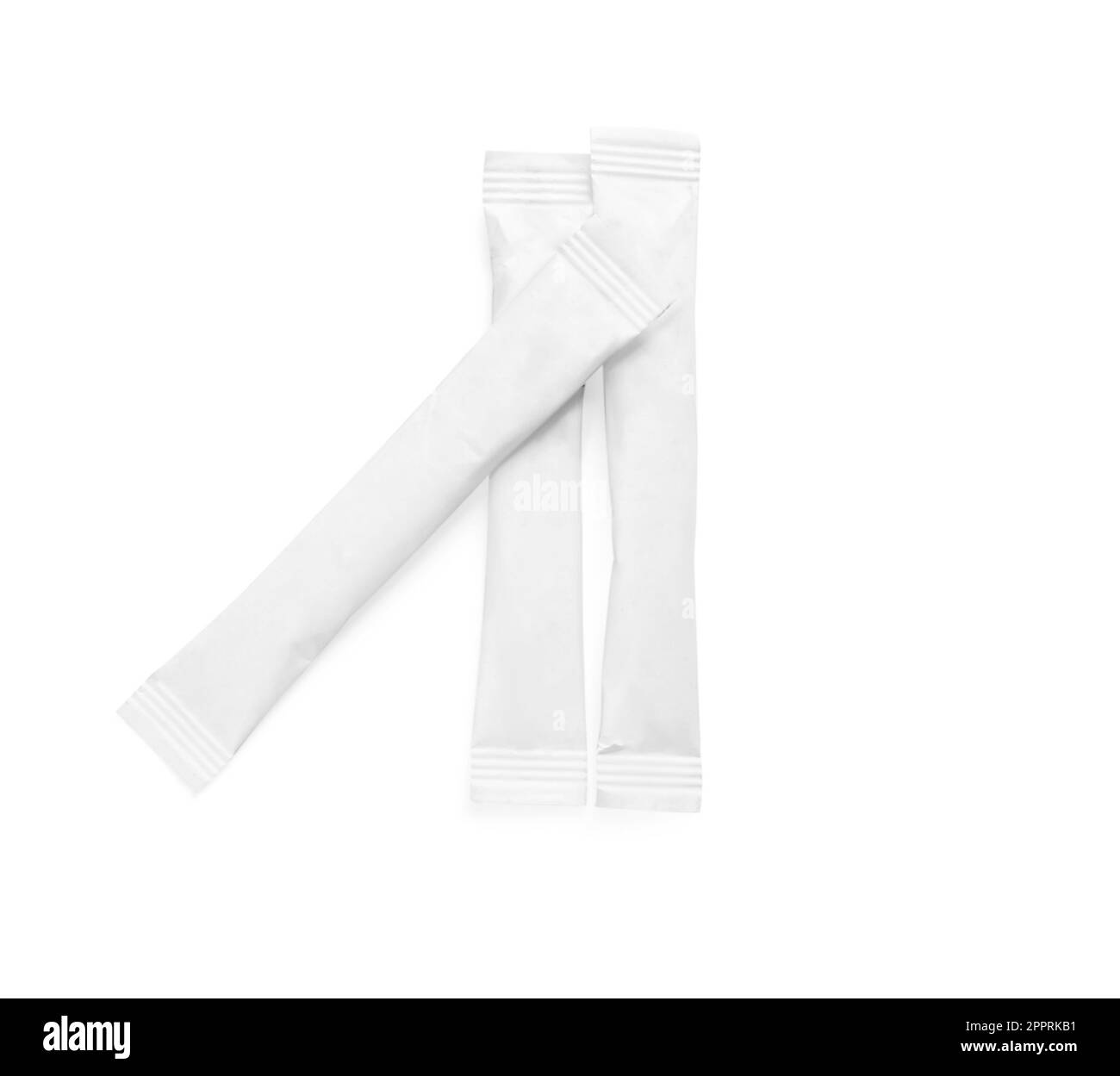 Paper sticks of sugar on white background, top view Stock Photo - Alamy