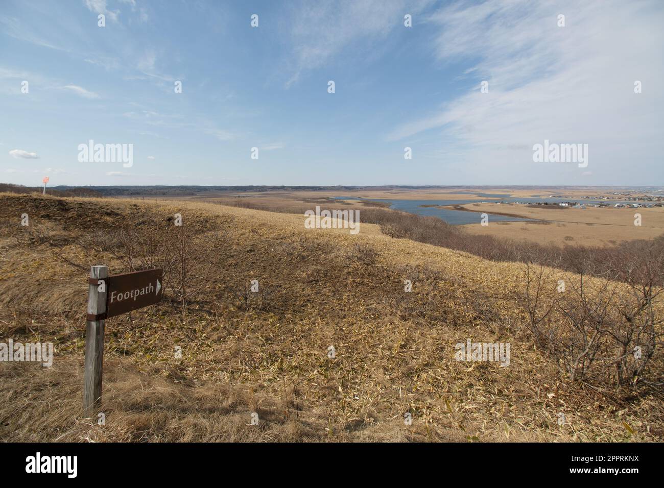 Footpath sign above protected wetland marsh area Stock Photo - Alamy