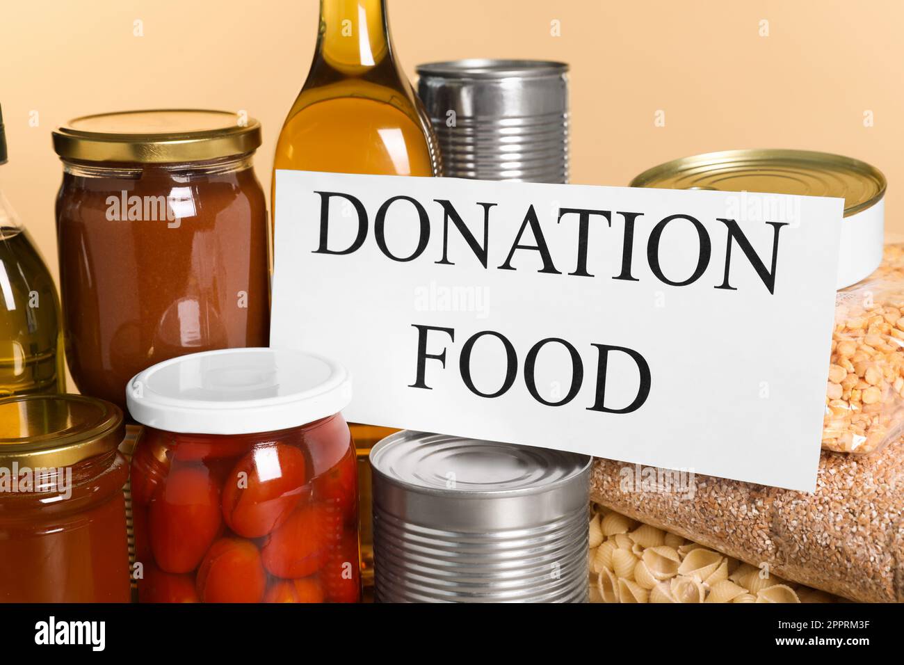 Card with words Donation Food and different products on beige ...