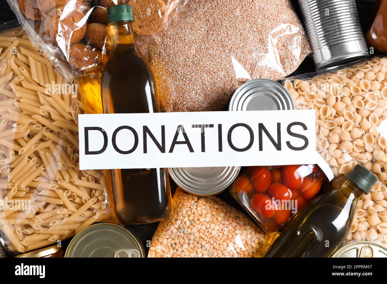 Card with word Donations on different products, top view Stock Photo ...