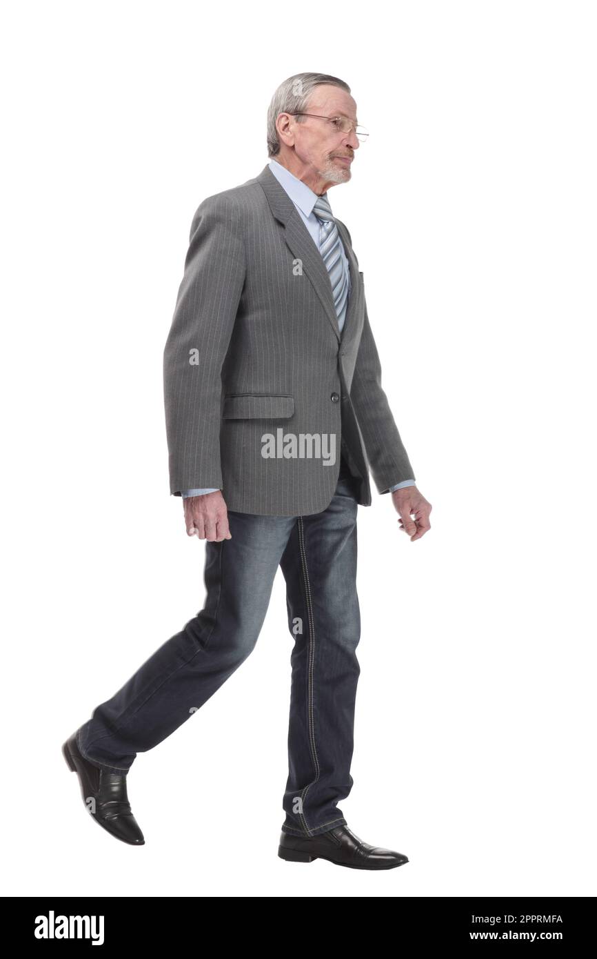 full length picture of a mid aged business man walking towards the ...