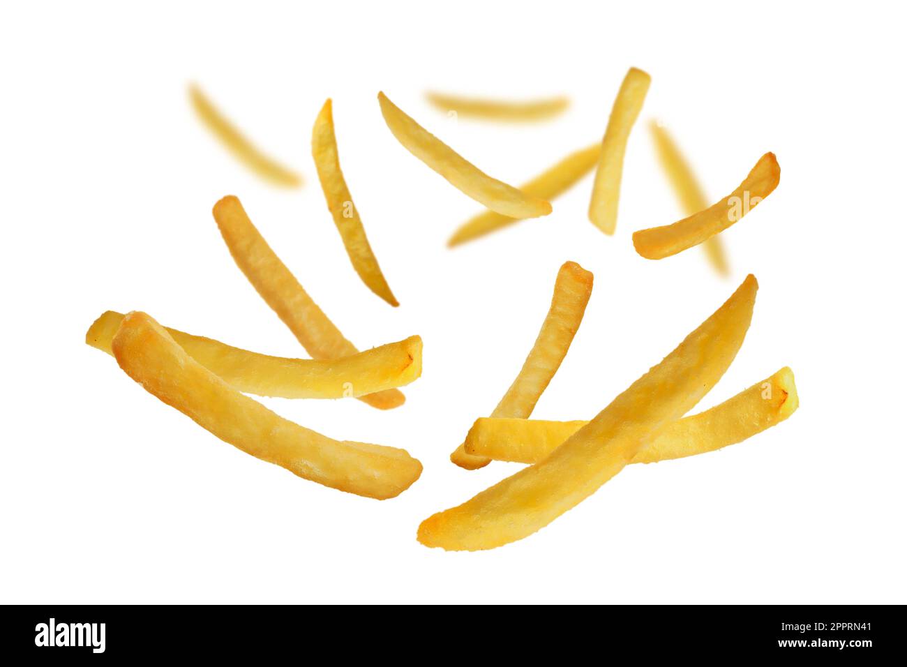 Tasty french fries falling on white background Stock Photo - Alamy