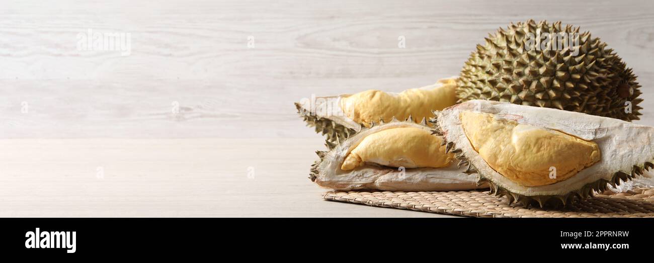 Fresh ripe durians on wooden table, space for text. Banner design Stock ...