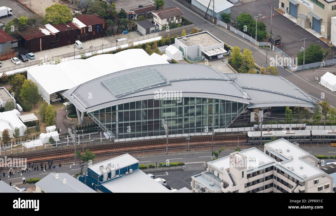 A train passes near the site of the derailment accident in Amagasaki City, Hyogo Prefecture on ...