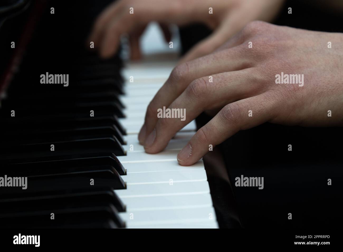 A musician playing the piano. Pianist's hands on the keyboard Stock Photo - Alamy