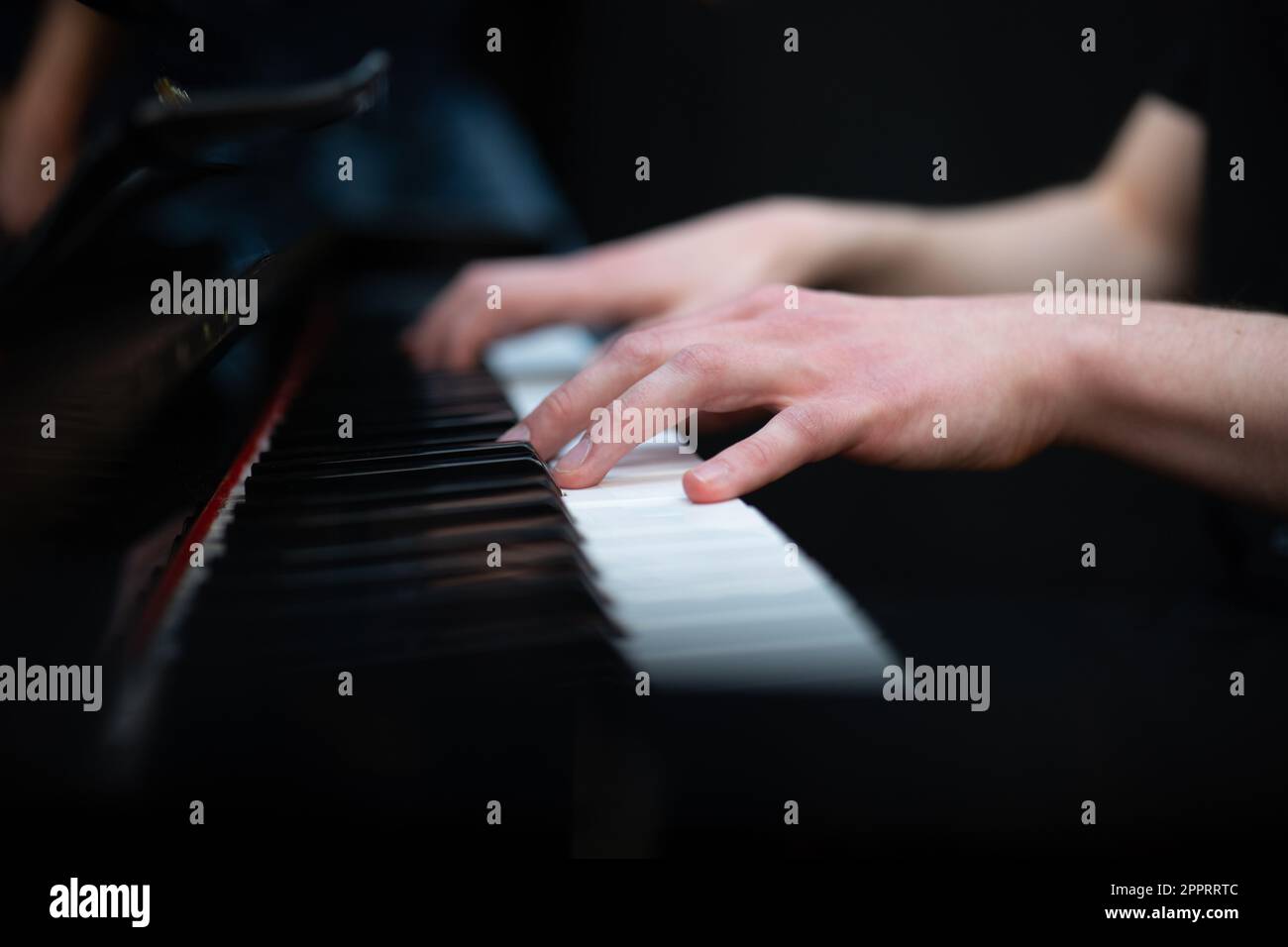 A musician playing the piano. Pianist's hands on the keyboard Stock Photo - Alamy