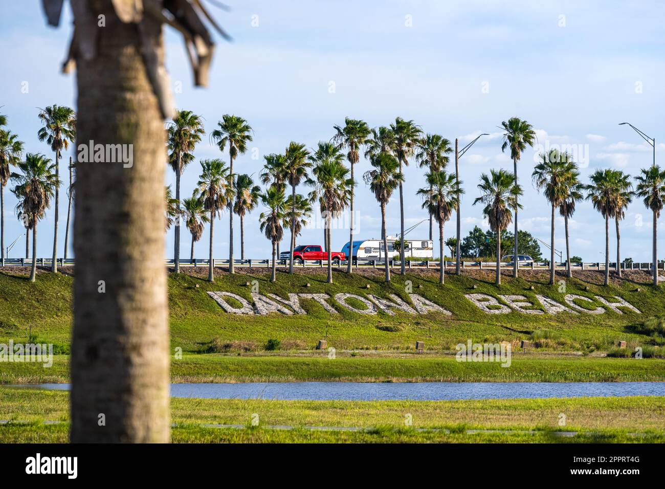 Iconic Daytona Beach lettering beneath a row of palm trees welcoming ...