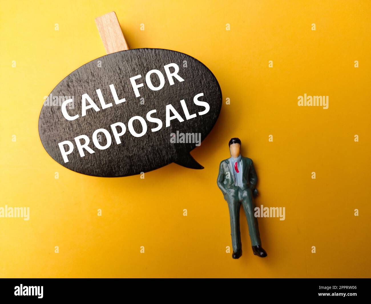 Wooden board and miniature people with the word CALL FOR PROPOSALS on ...