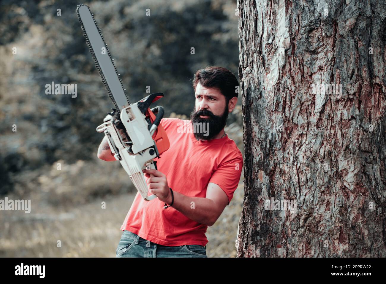 Lumberjack concept. Lumberjack worker walking in the forest with ...