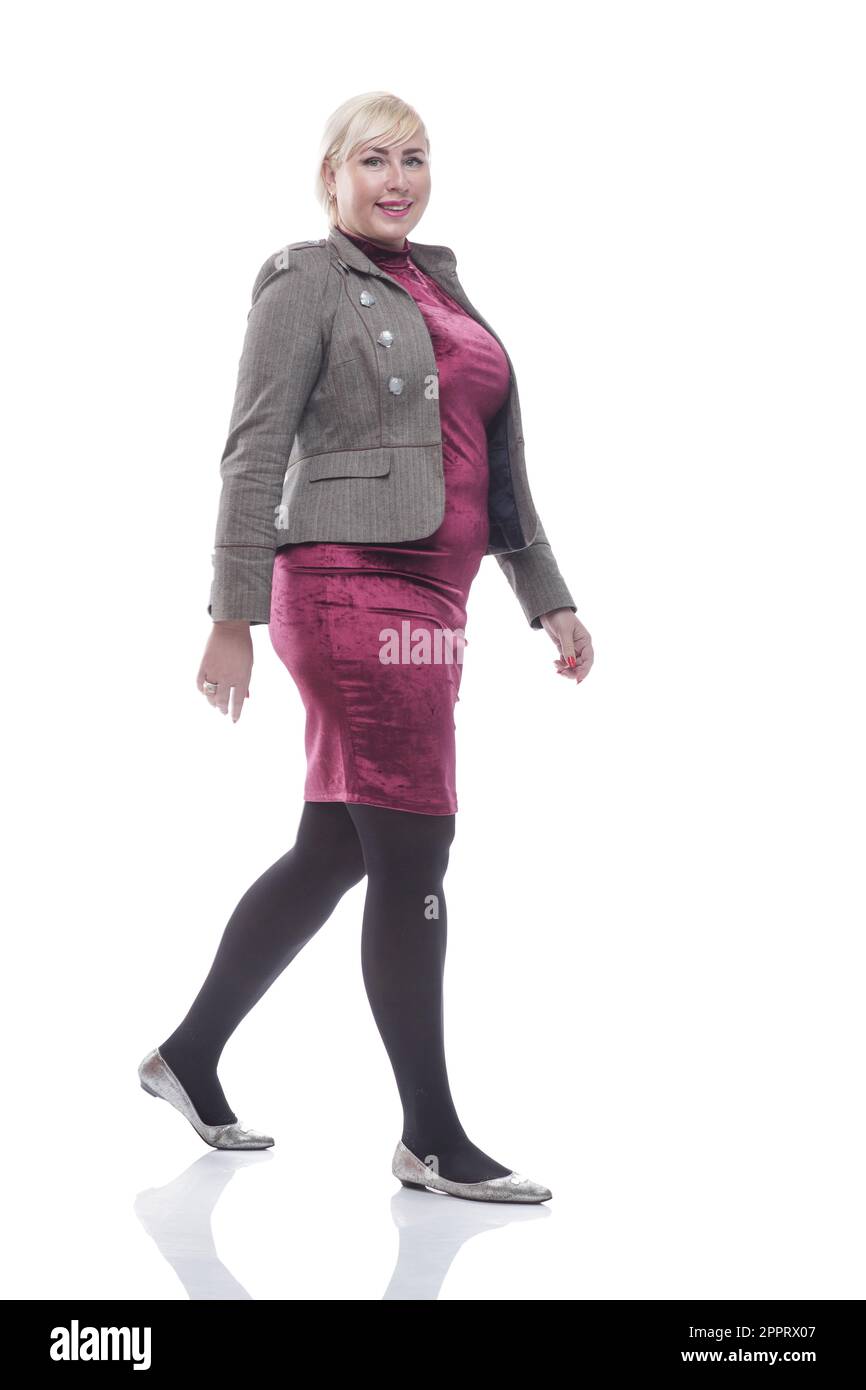 casual young woman stepping forward . isolated on a white Stock Photo ...