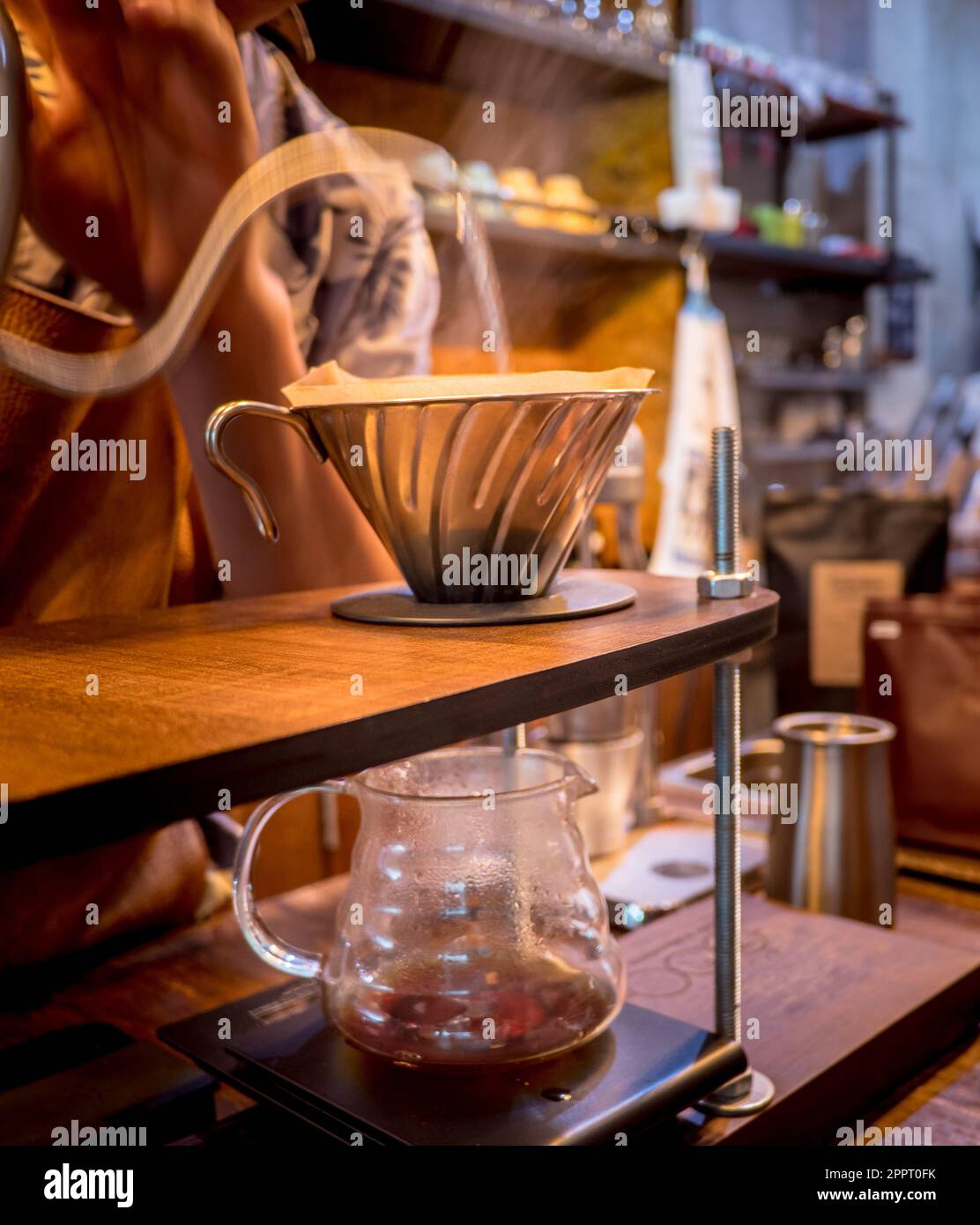 Hand drip coffee. Barista pouring water from silver teapot Stock Photo ...