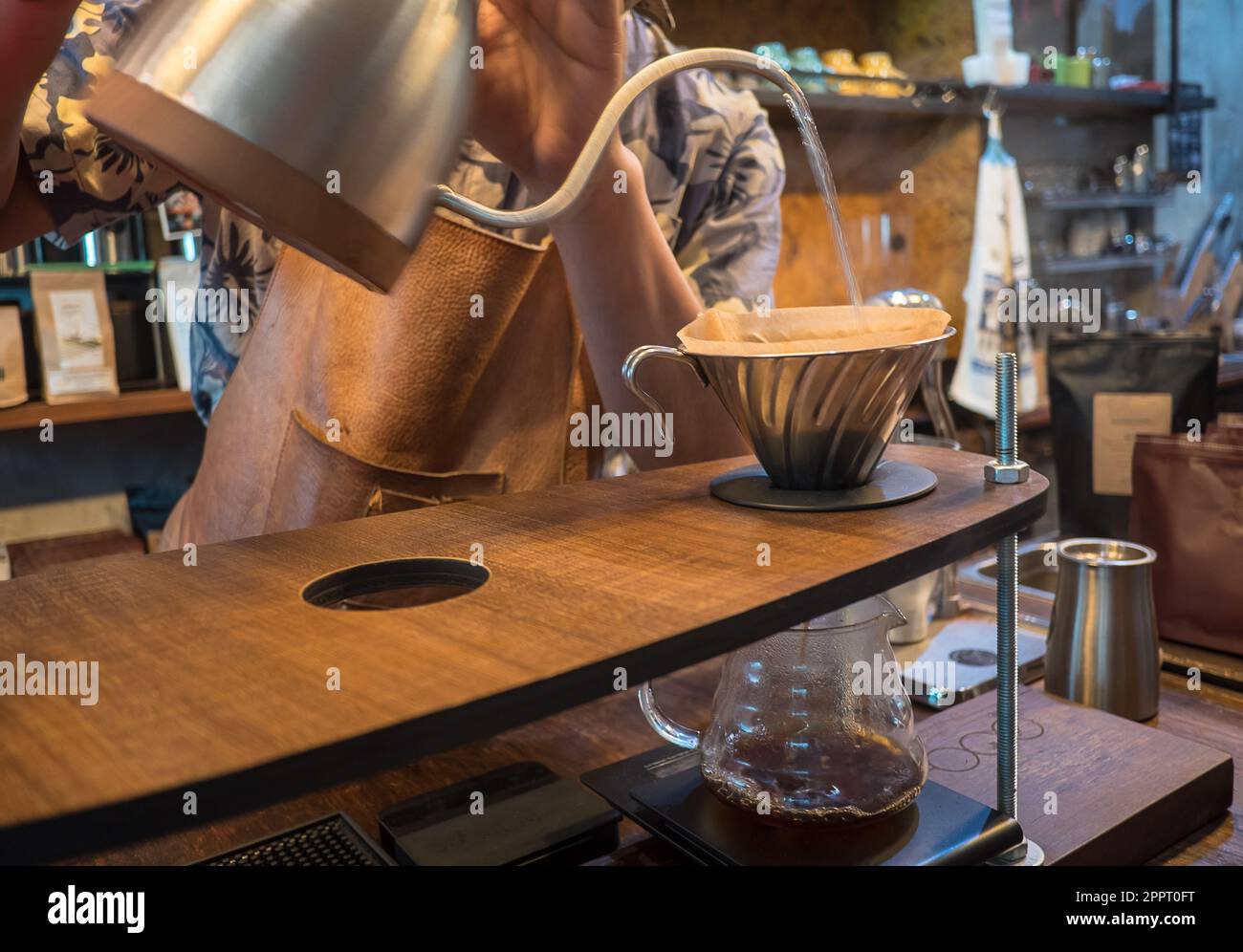 Hand drip coffee. Barista pouring water from silver teapot Stock Photo ...