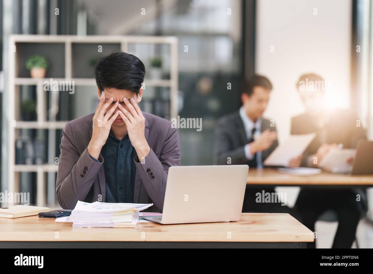 Stressed business person working and research strategy on laptop and ...